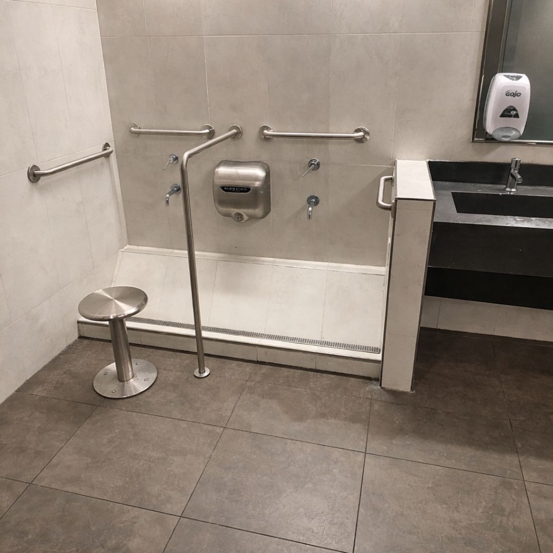 Saw this in a restroom which has faucets and drain down low and a dryer ...